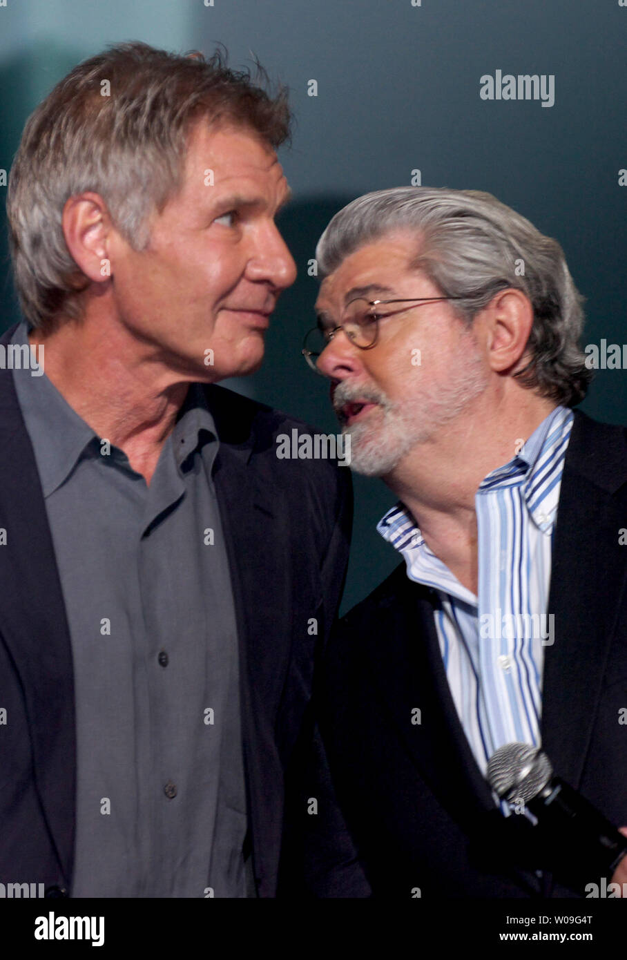 Actor Harrison Ford (L) and Executive Producer George Lucas attends the ...
