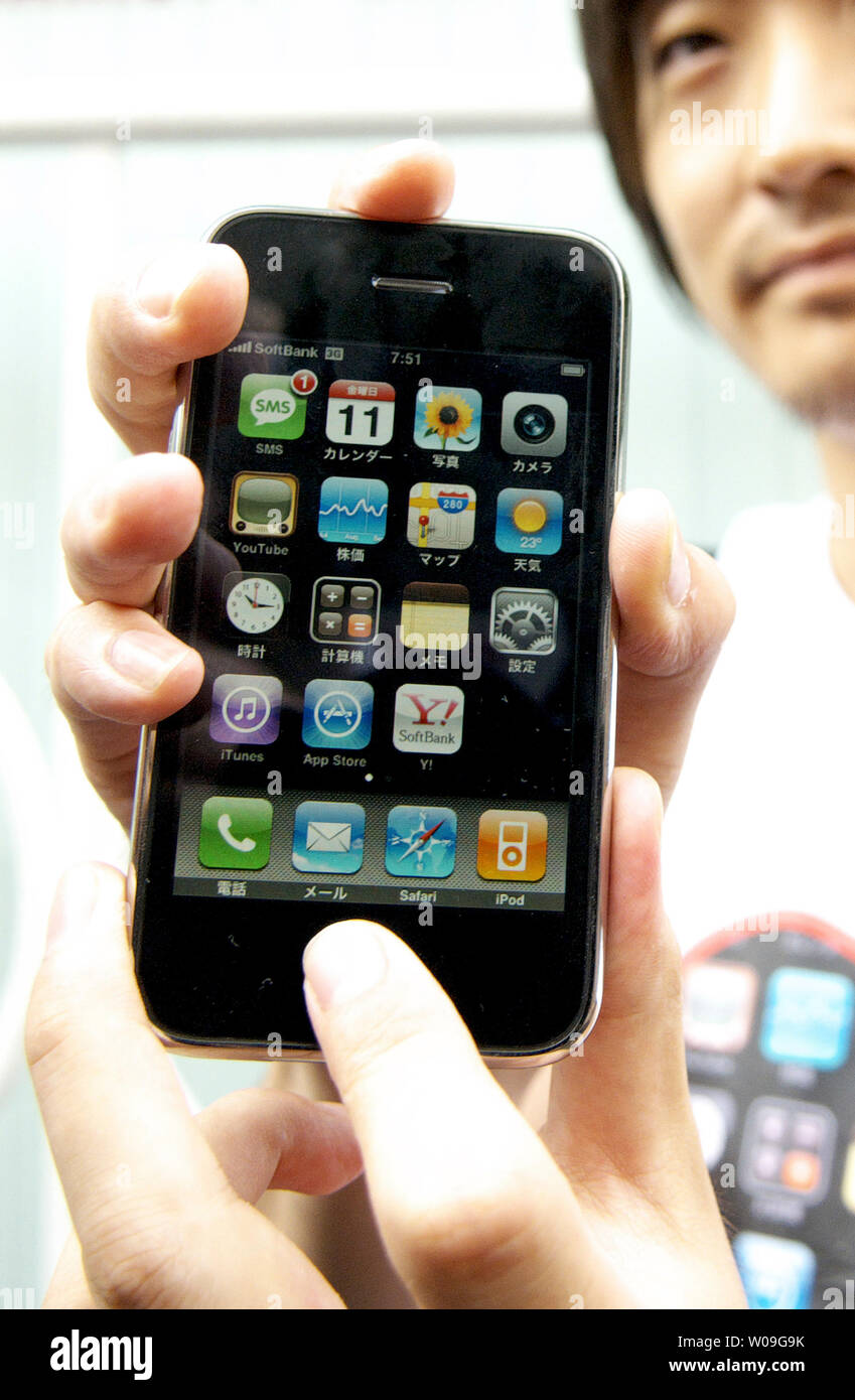 A buyer shows off his new purchase during the debut of the iPhone 3G in ...