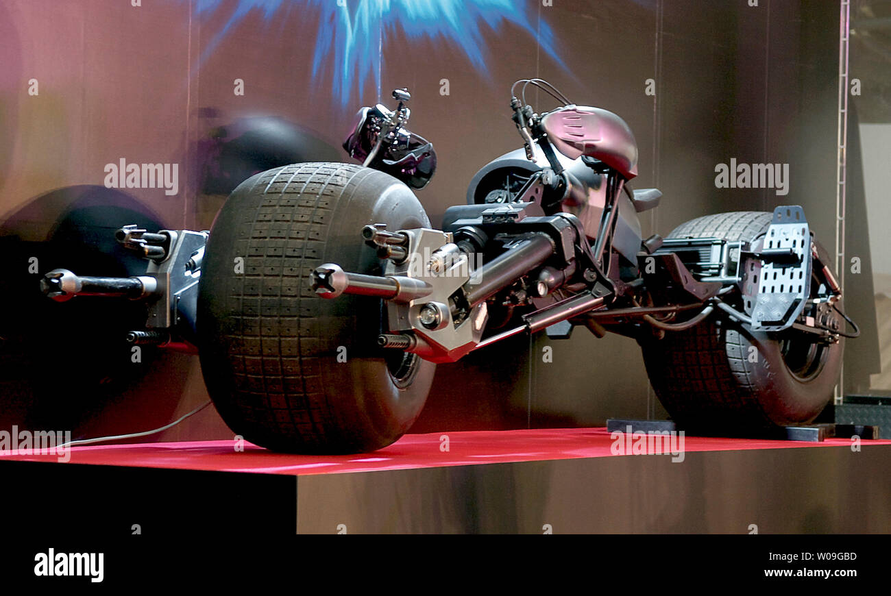The "Bat Pod," Batman's motorcycle, is displayed on the stage during ...