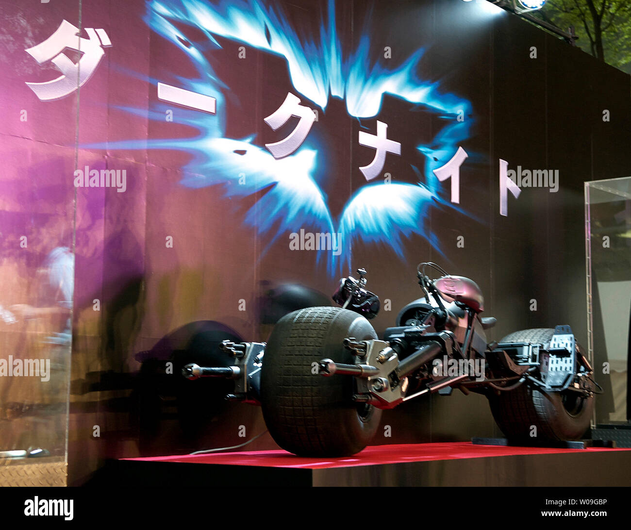 The "Bat Pod," Batman's motorcycle, is displayed on the stage during ...