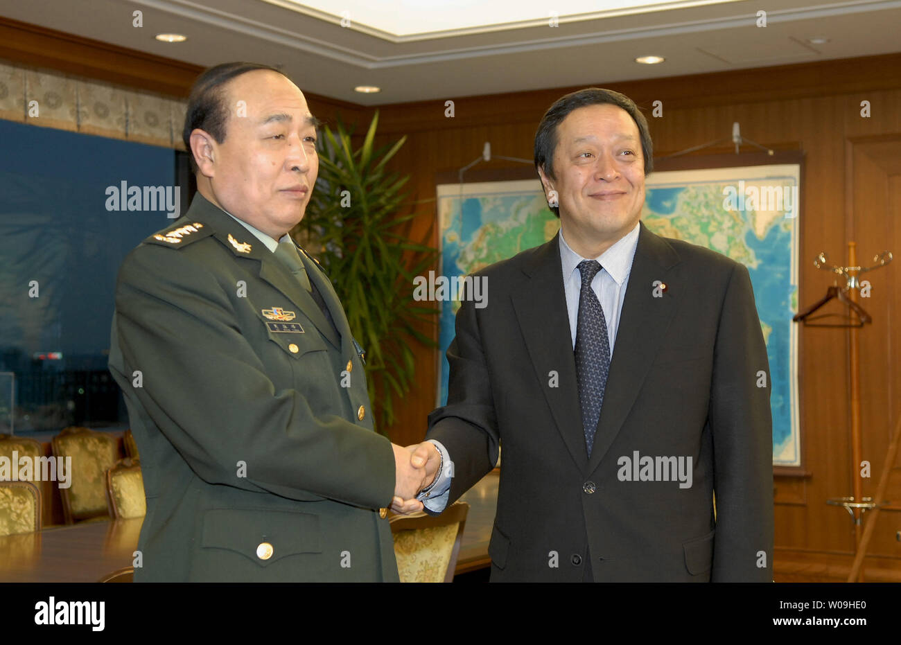 Japan's Defense minister Yasukazu Hakmada shake hands with General Ge ...