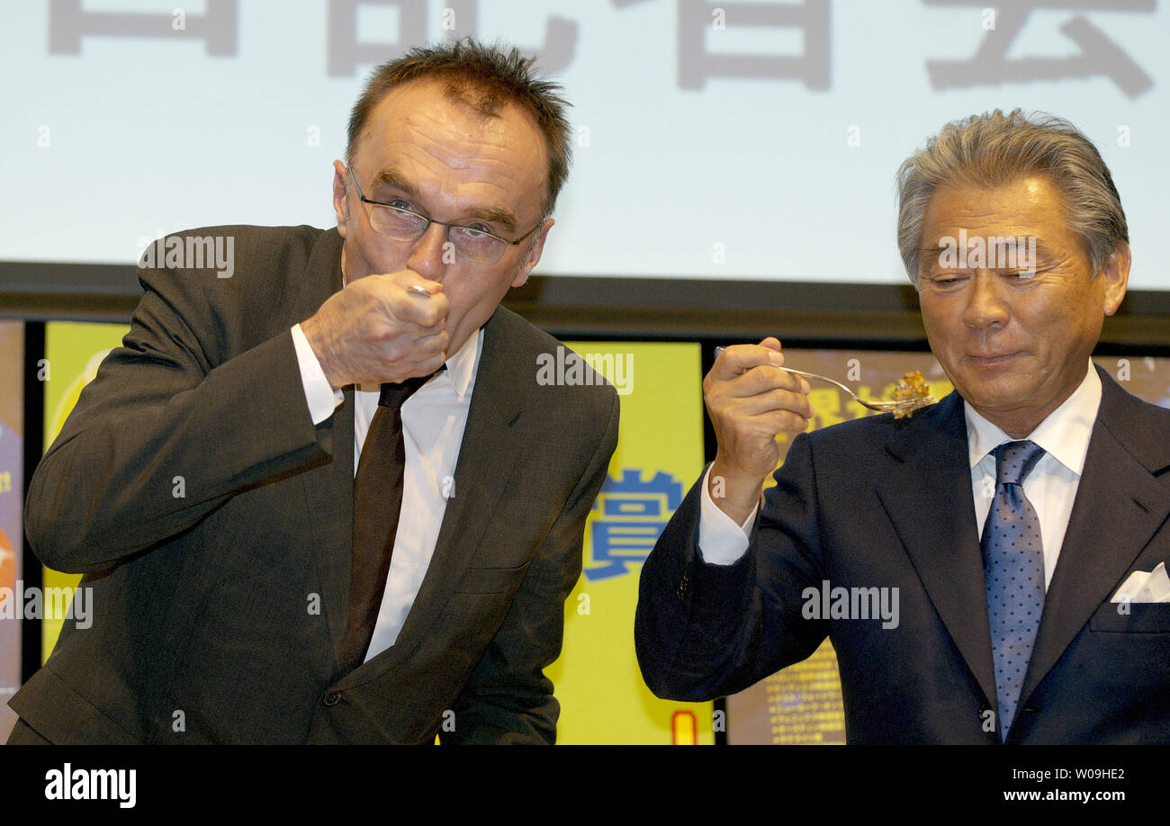 Oscar nominee director Danny Boyle (L) eats a pork cutlet with Japanese ...