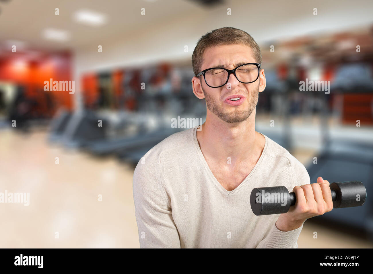 Weak man lifting heavy weight hi-res stock photography and images - Alamy