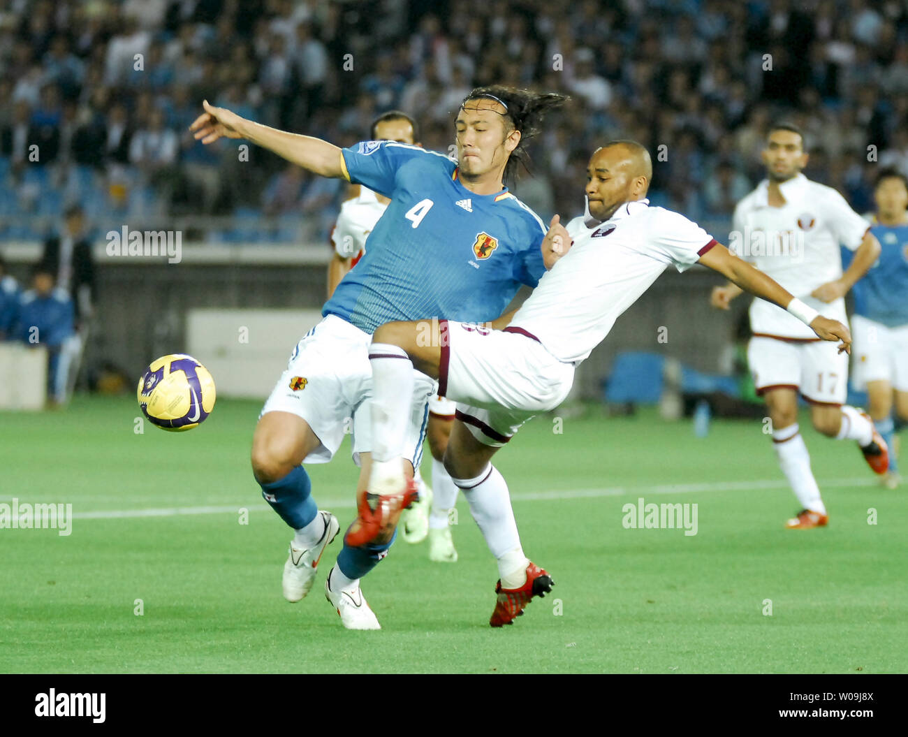 Japan's defender Marcus Tulio Tanaka(L) and Qatar's defender Hamed ...