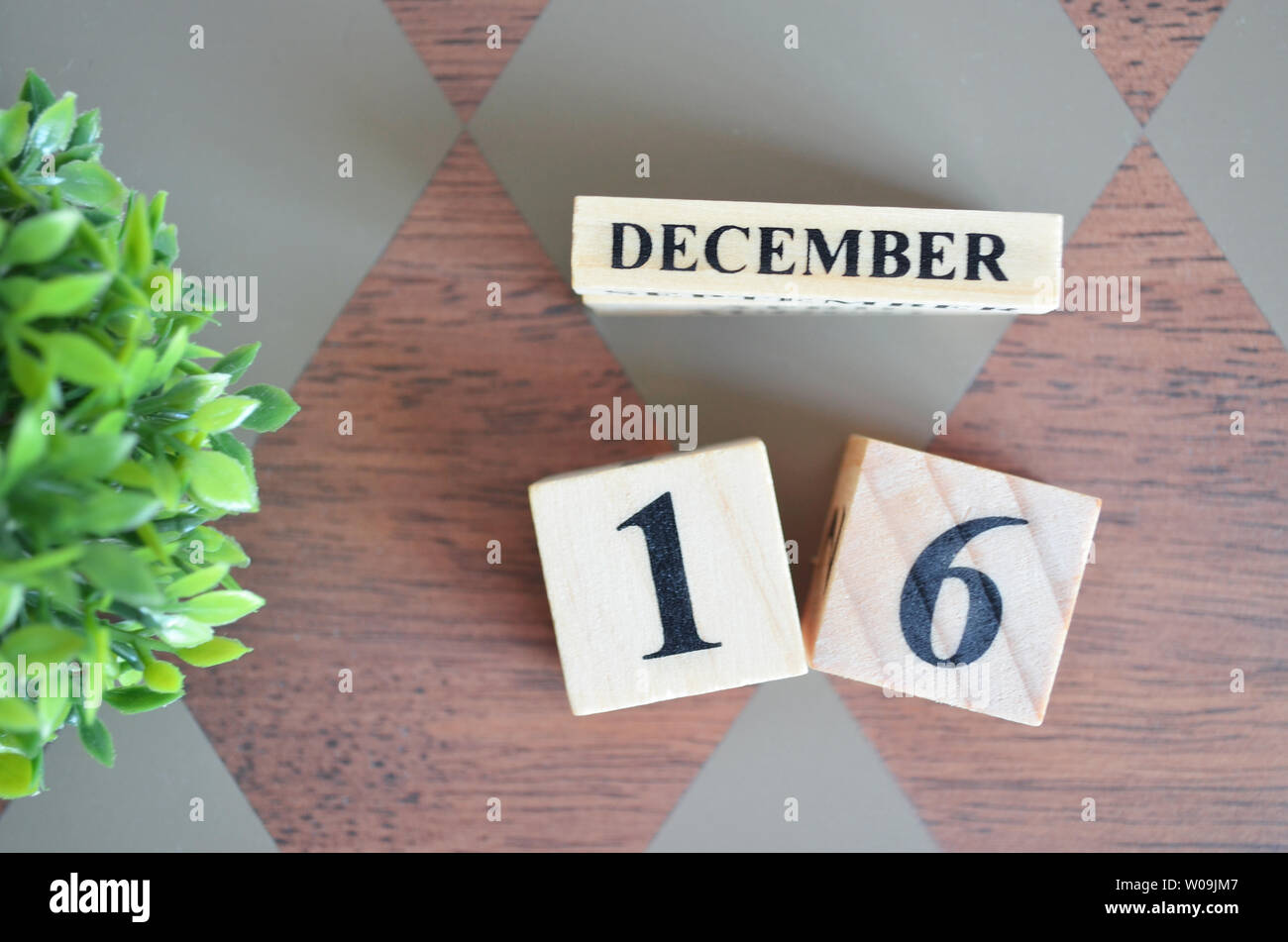 Date of December month with leaf on diamond pattern table for ...