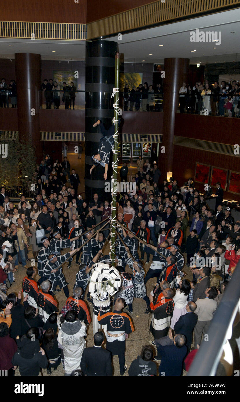 Traditional Japanese firefighters display their balancing skills atop ...