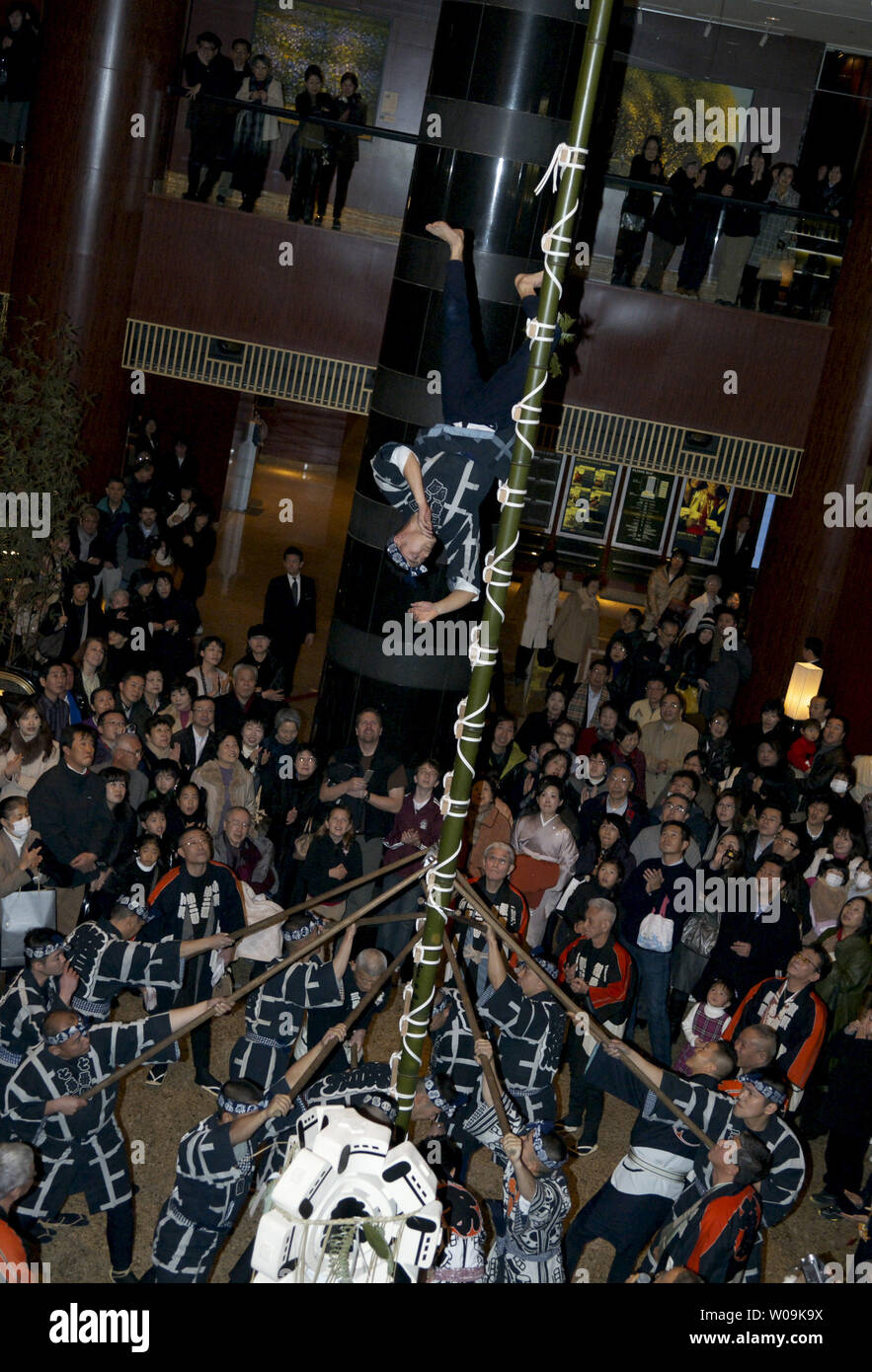 Traditional Japanese firefighters display their balancing skills atop ...