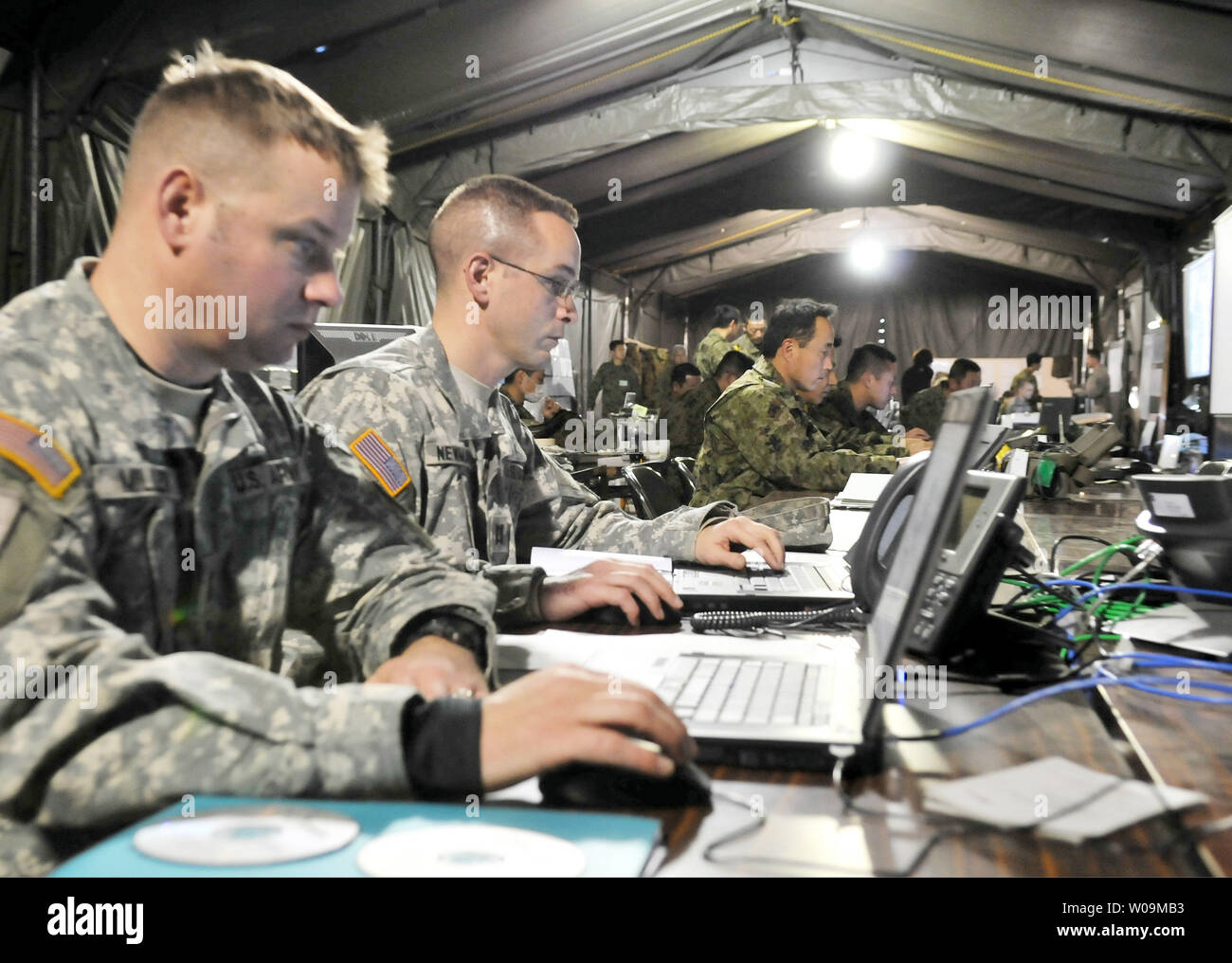U.S. and Japanese soldiers follow computer simulations during joint ...