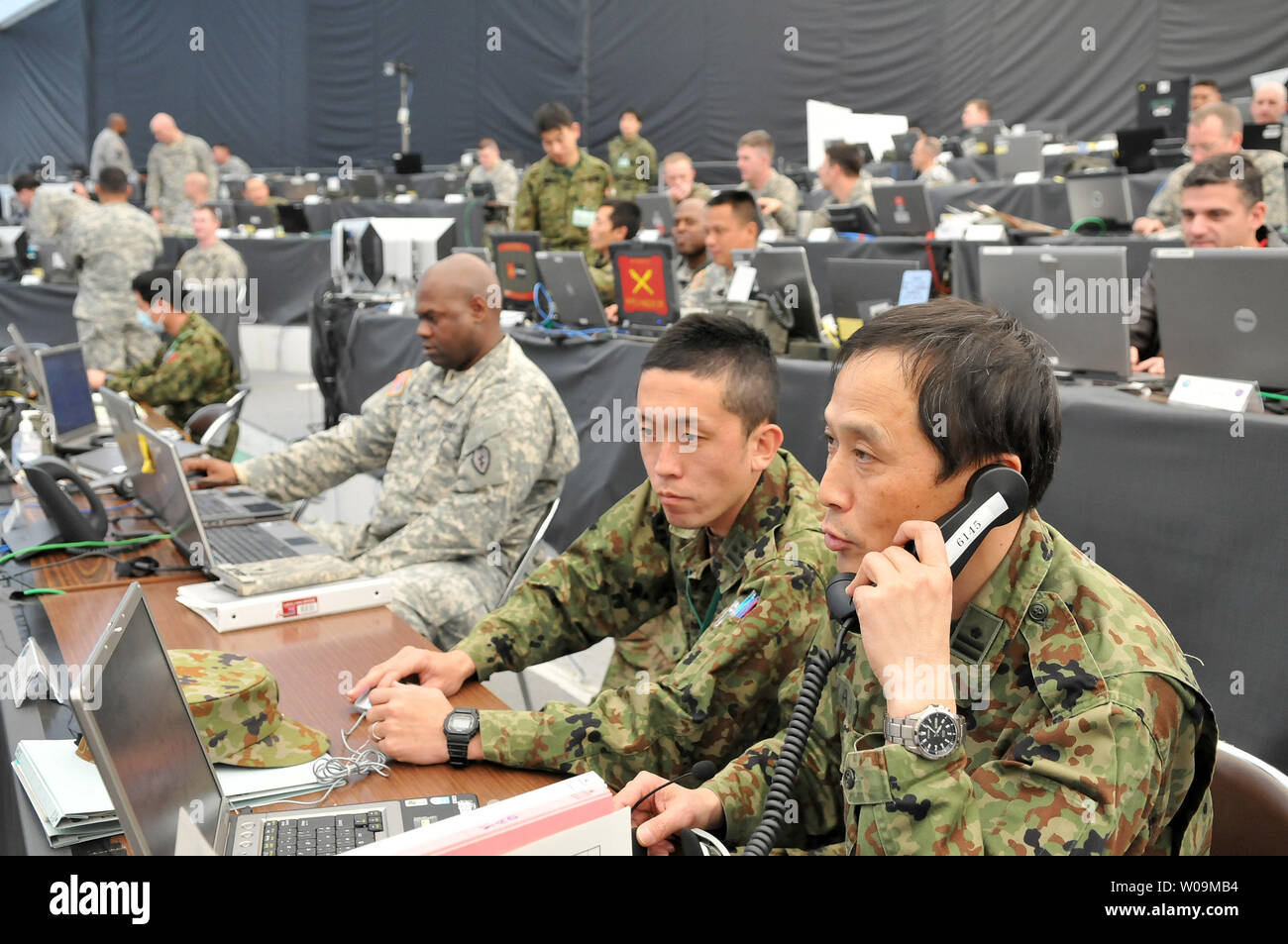 U.S. and Japanese soldiers follow computer simulations during joint ...