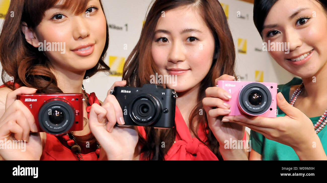 Japan models pose with new digital camera hi-res stock photography and ...