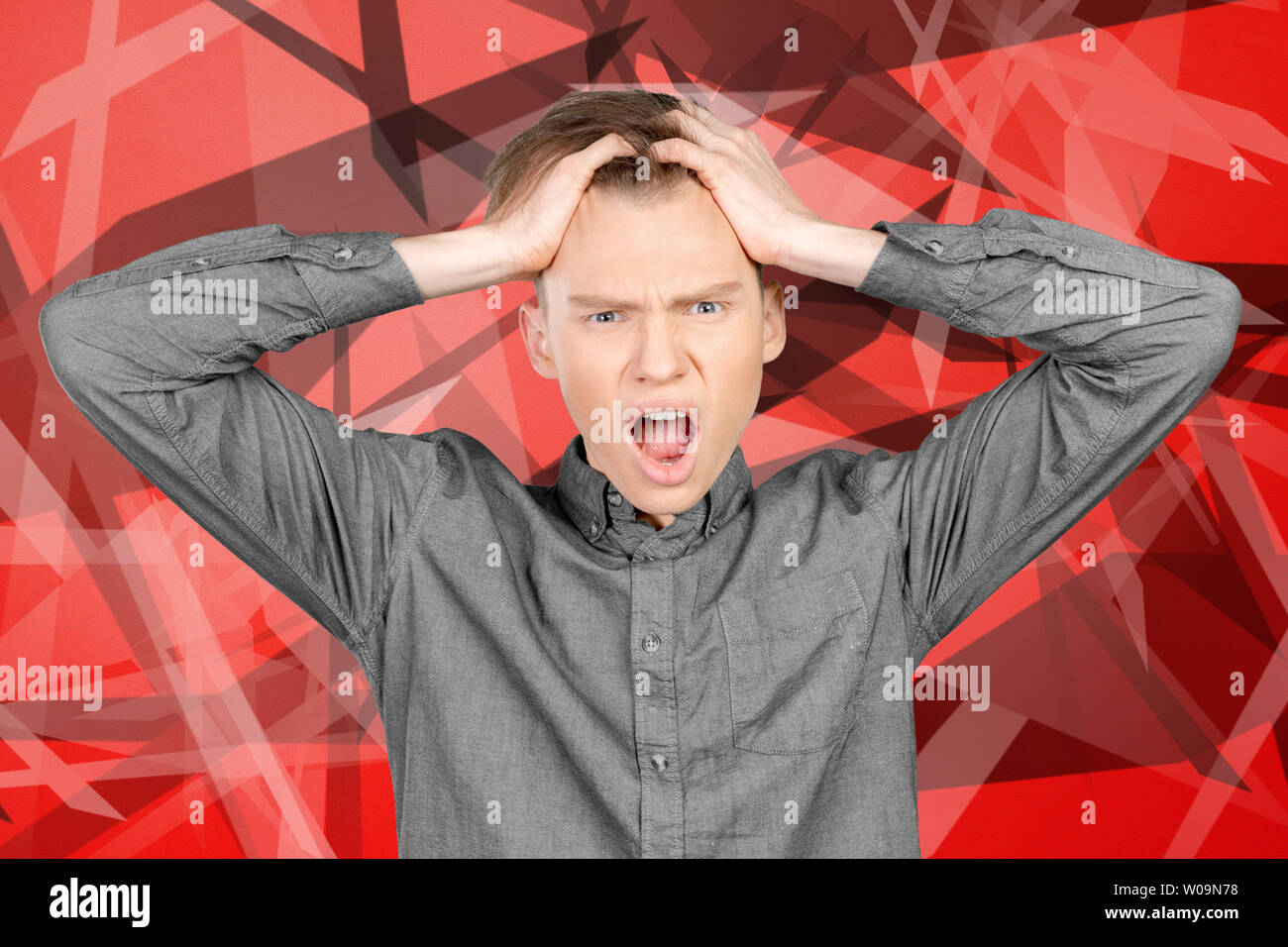 Angry man expressing aggression Stock Photo - Alamy