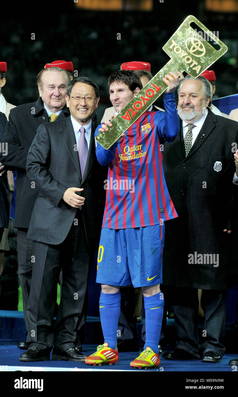 Barcelona's Lionel Messi(R2) poses with Akio Toyota(L), President of ...