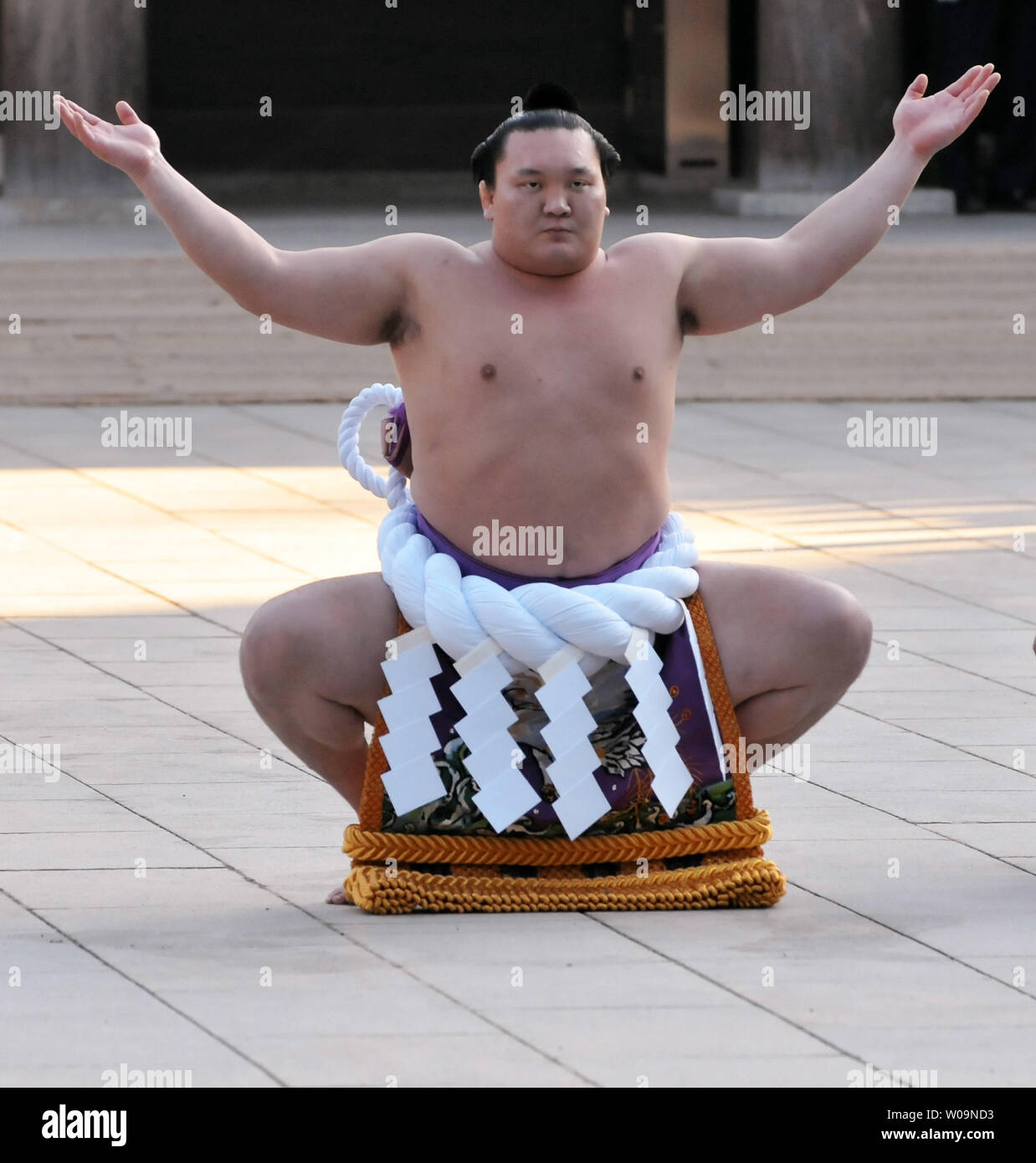 Mongolian grand sumo champion Yokozuna Hakuho performs the "ring entering ceremony" during a ...