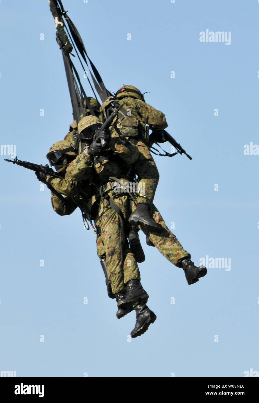 A members of Japan's Ground Self-Defense Force performing heliborne ...