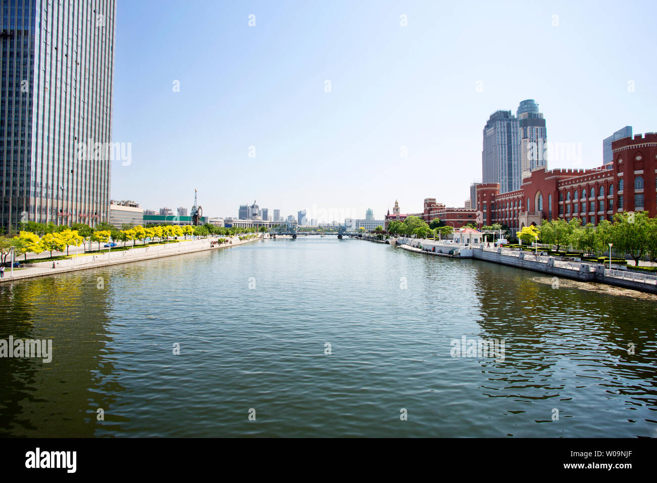 modern buildings in urban city at riverbank Stock Photo - Alamy