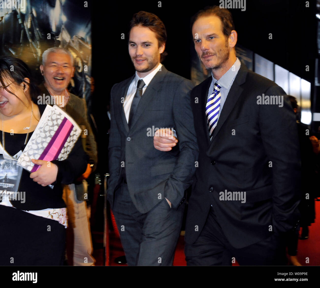 Actor Taylor Kitsch(C) and director Peter Burg attend the world ...