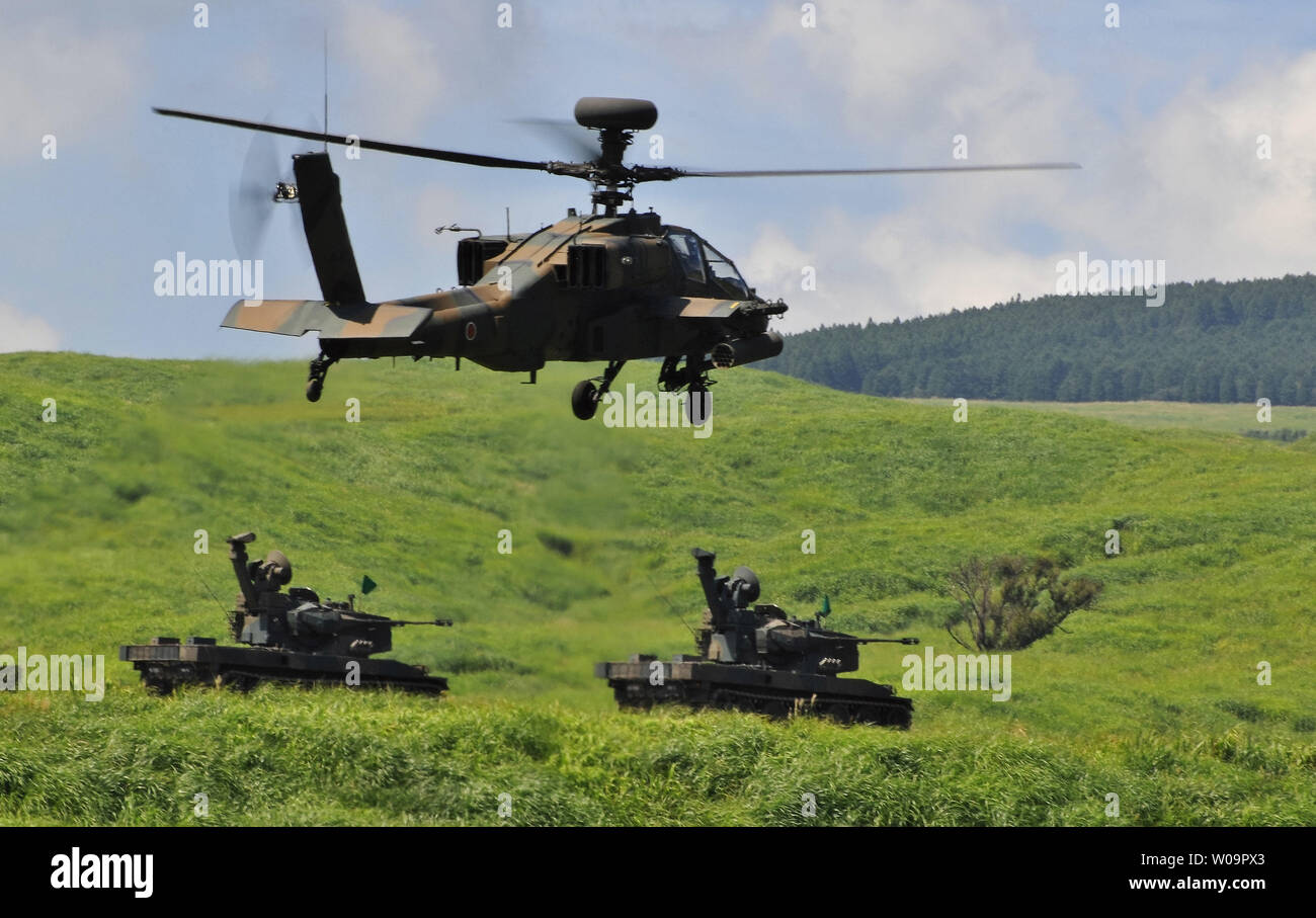 Japan's Ground Self-Defense Force's helicopter AH-64D Apache Longbow(Front) takes part in the ...