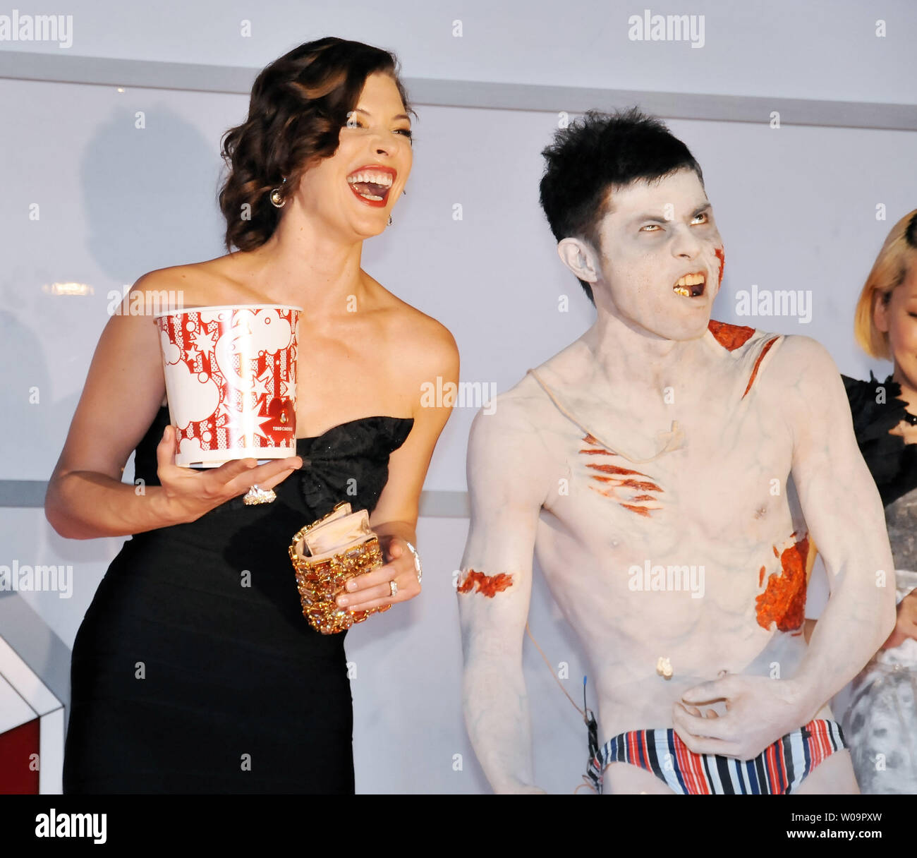 Actress Milla Jovovich and comedian Yoshio Kojima attend the world premiere for the film ...