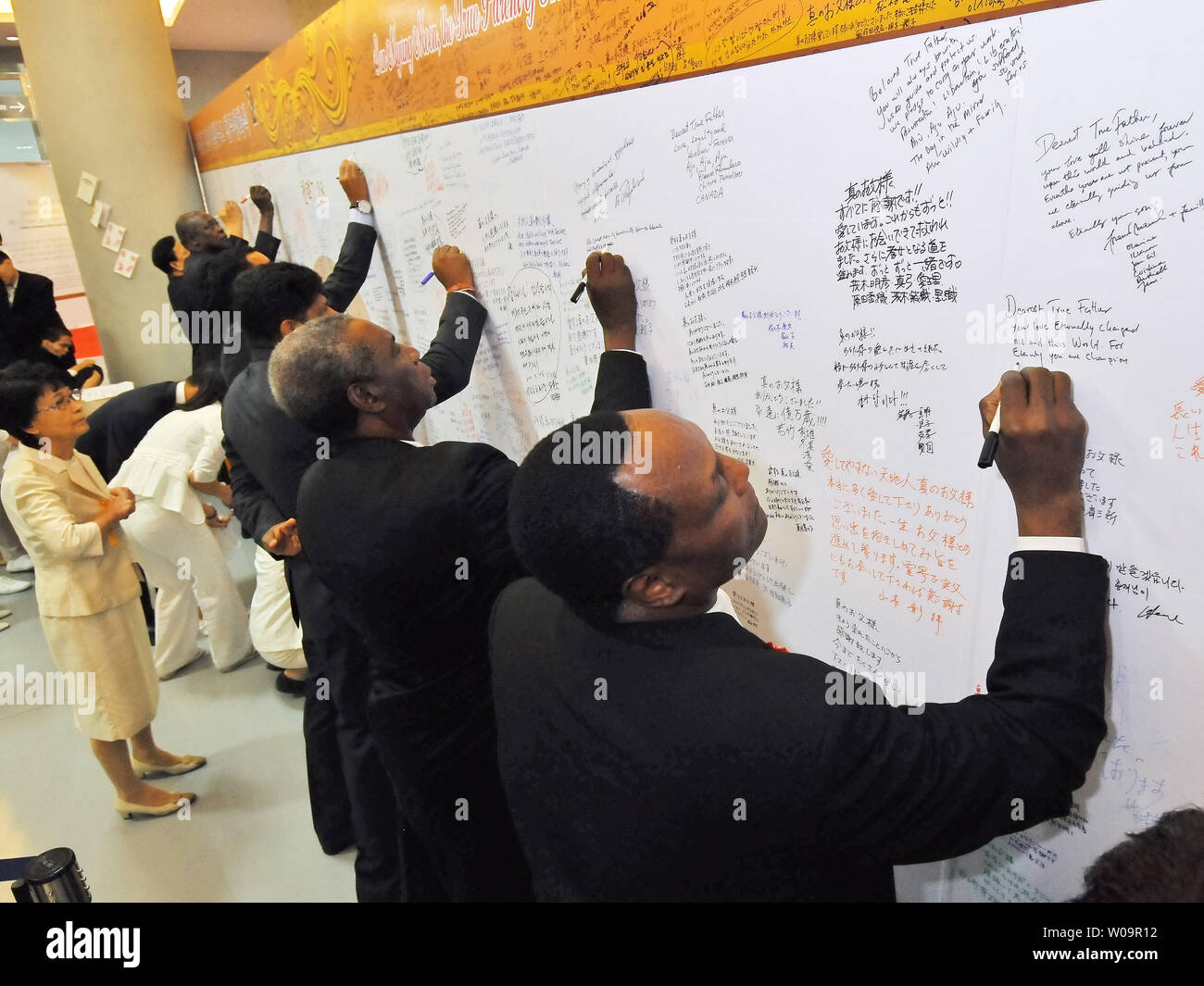 Members of the Unification Church write messages to the church's ...