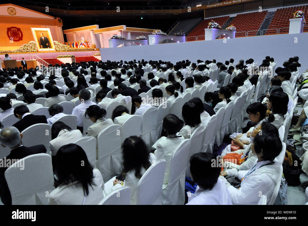 Members of the Unification Church pray for the church's founder Rev ...