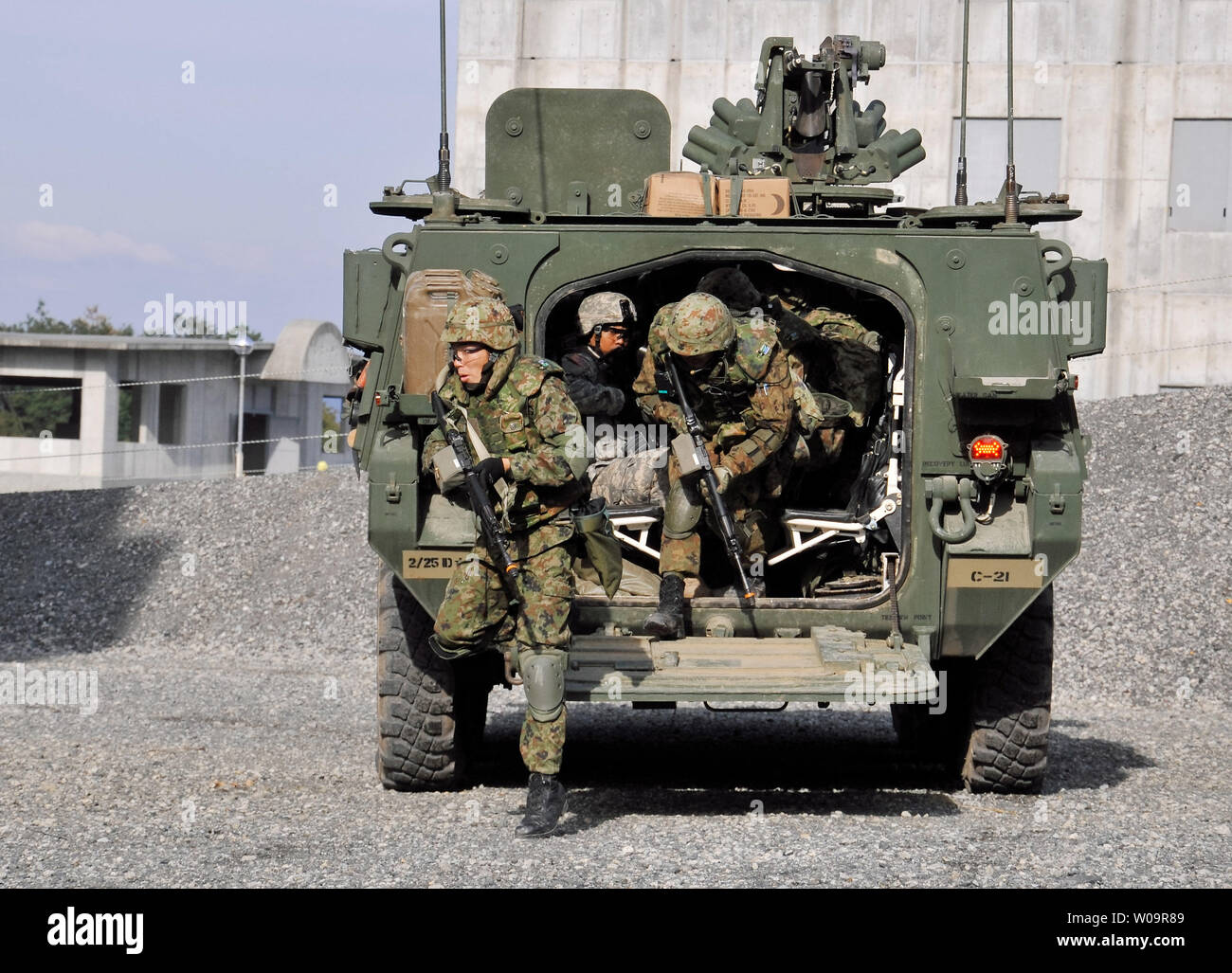 Members of Japan Ground Self Defense Force get out from stryker during ...