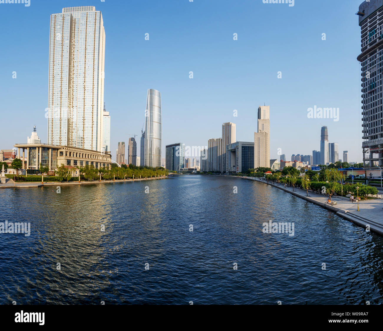 modern buildings in urban city at riverbank Stock Photo - Alamy