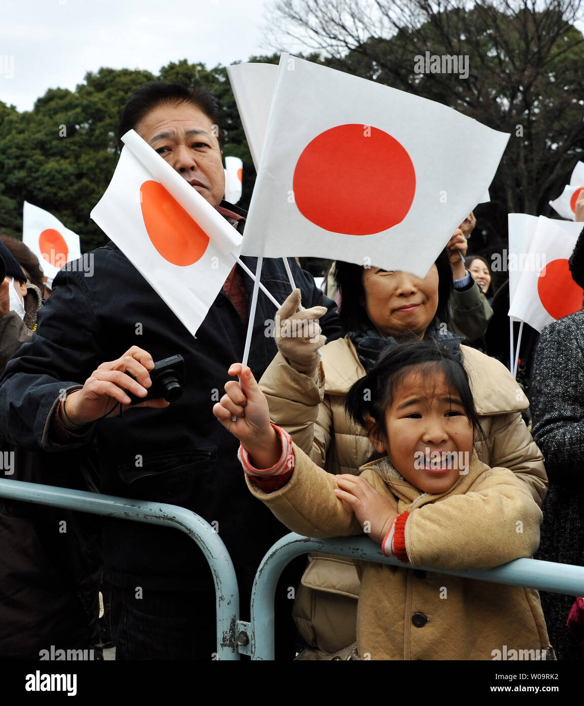 Well-wishers wave Japan's national flag during a birthday greeting for ...