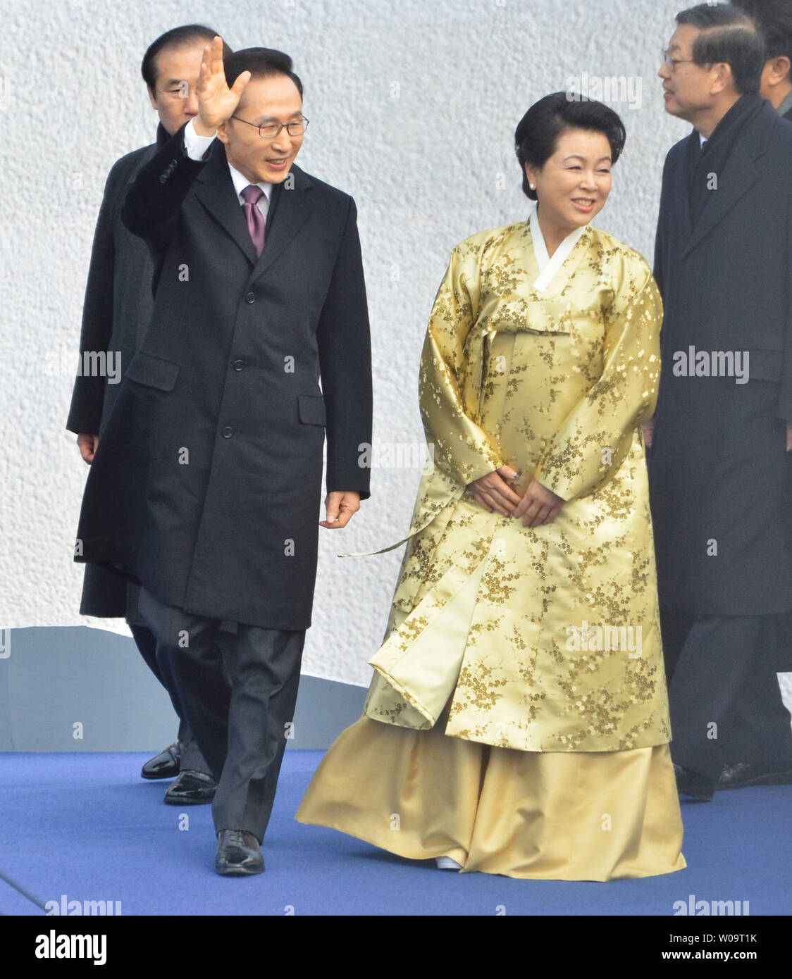 South Korea's outgoing President Lee Myung-bak(L) and his wife Kim Yoon ...