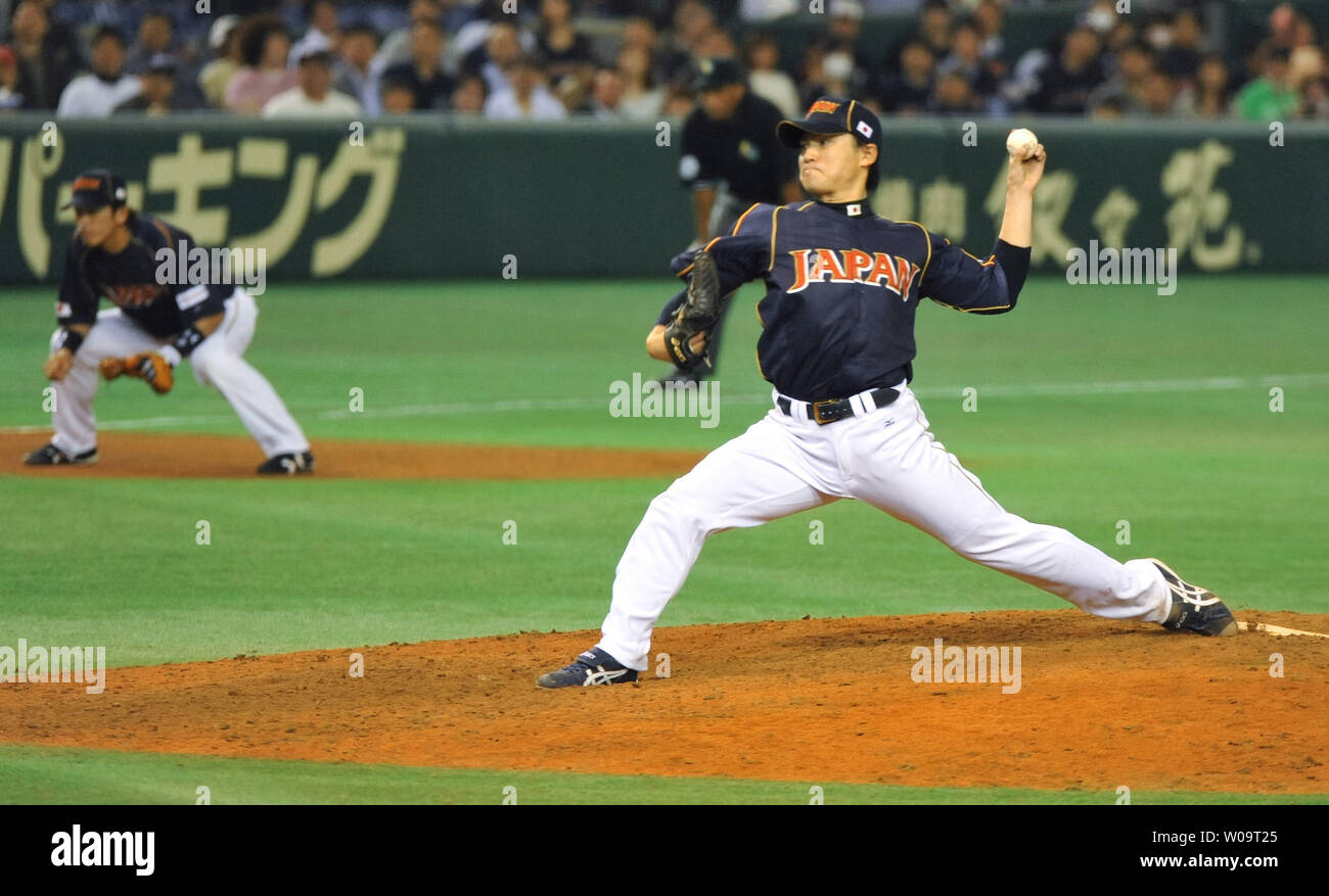 Japan's closer Toshiya Sugiuchi throws a pitch in the 10 inning against ...