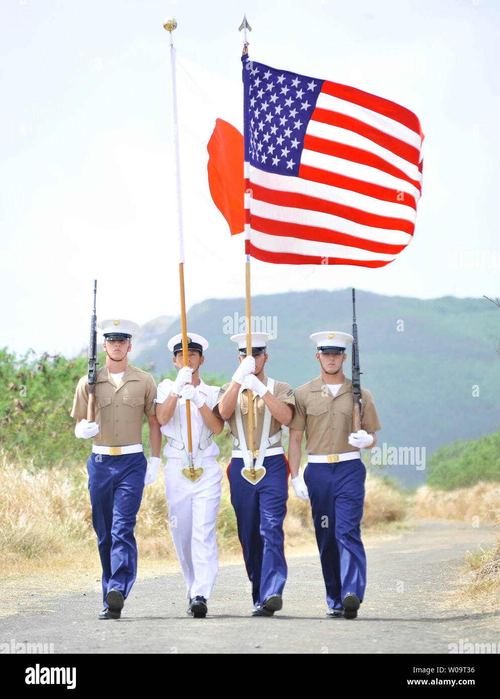 U.S. and Japanese color guards walk during the "Battle of Iwo Jima ...
