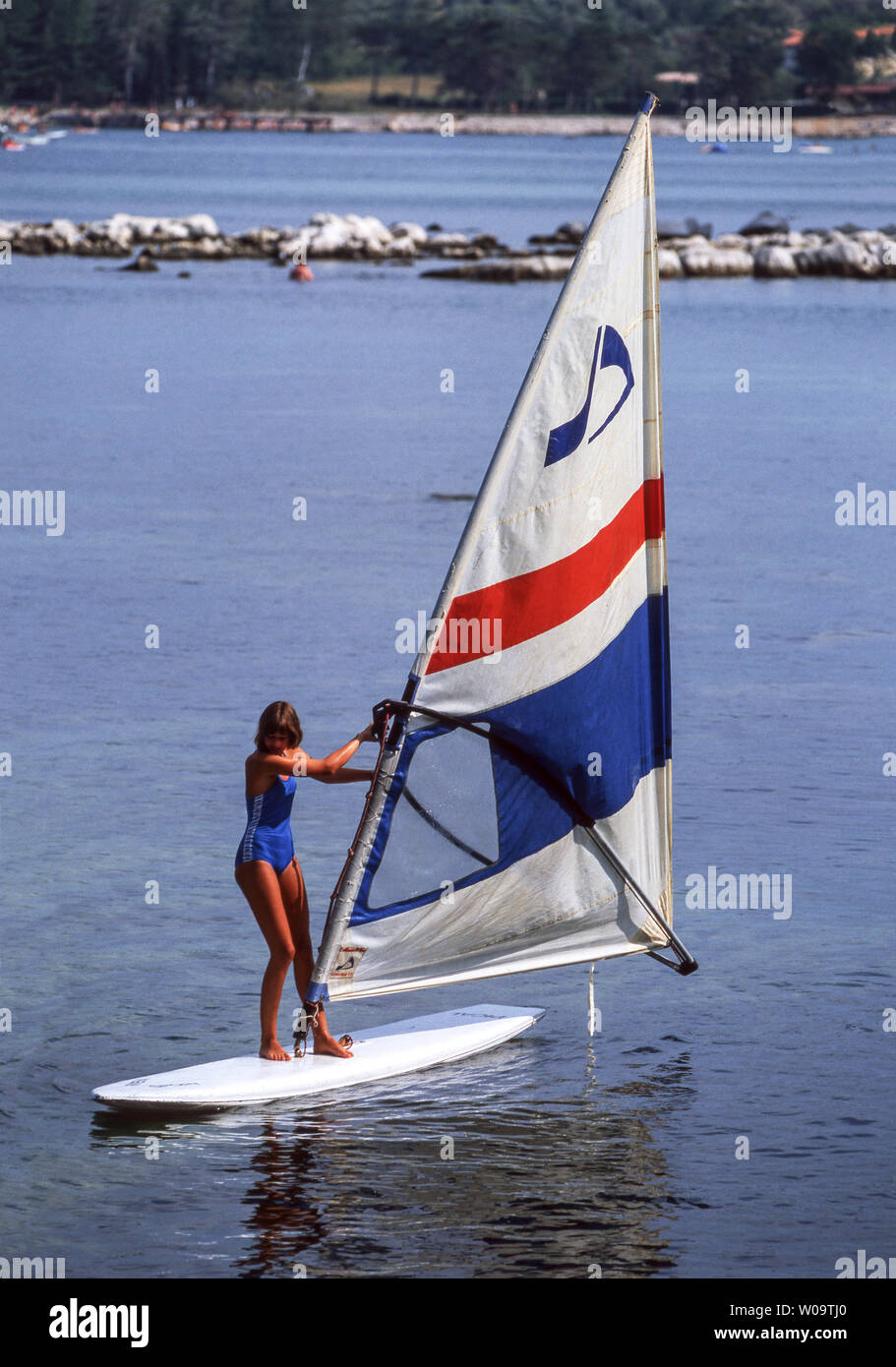 Girl learning to sail-board.The Mediterranean coast near Cannes Stock ...