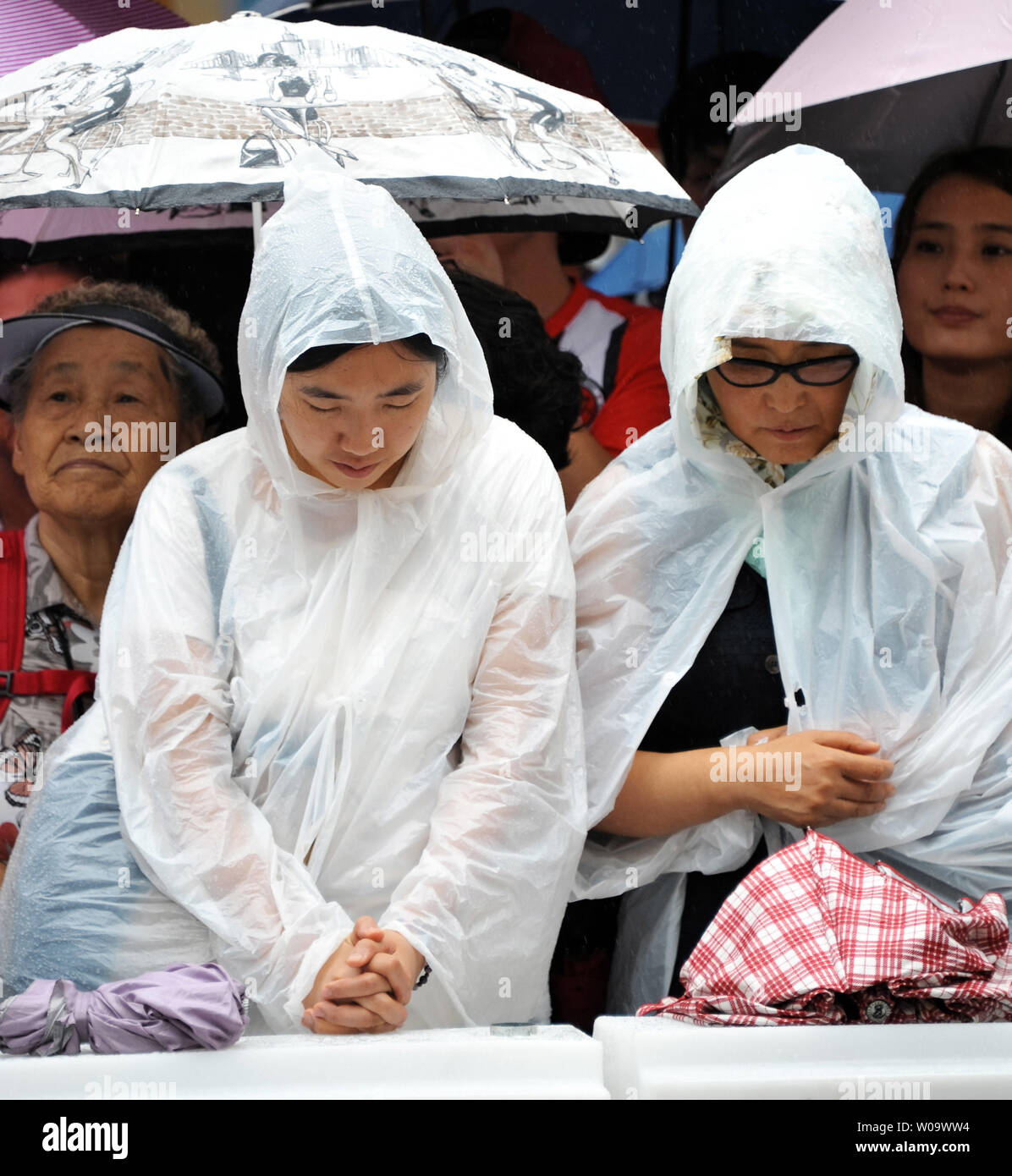 Well-wishers pray during "Mass for peace and reconciliation" outside of ...