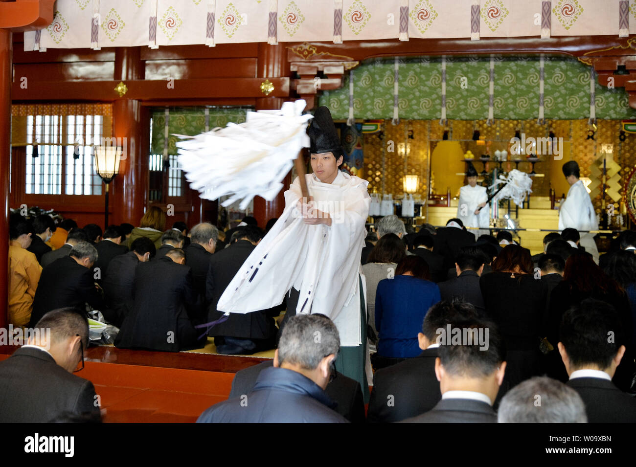 A Shinto priest performs the "Oharai" (ritual of purification) for ...