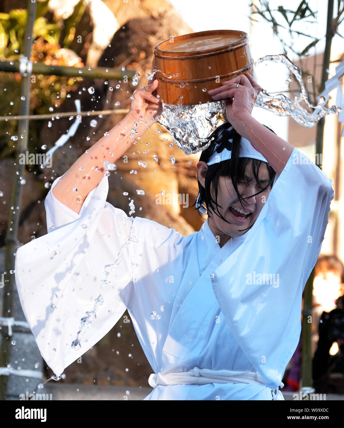 Participants purify oneself by cold water during the the cold-endurance ...
