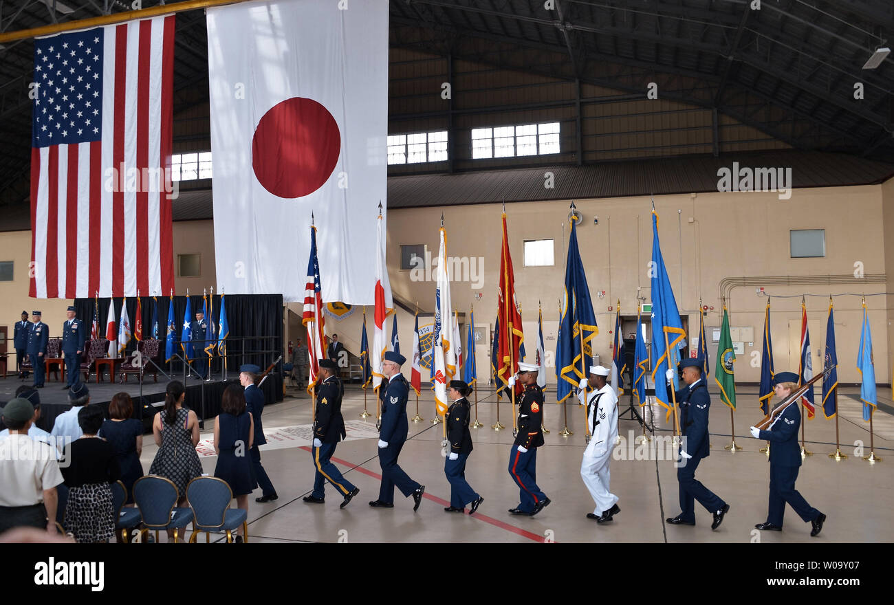 Color guards walk during a change of command ceremony at Yokota air ...