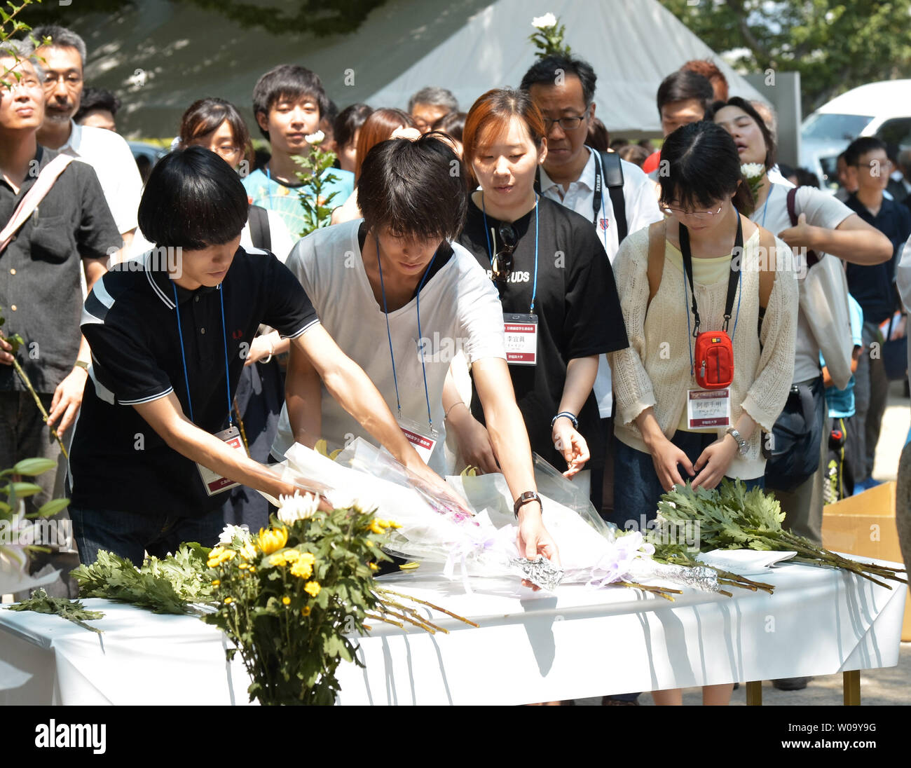 Japanese and Korean College students offer flowers for Korean atomic ...