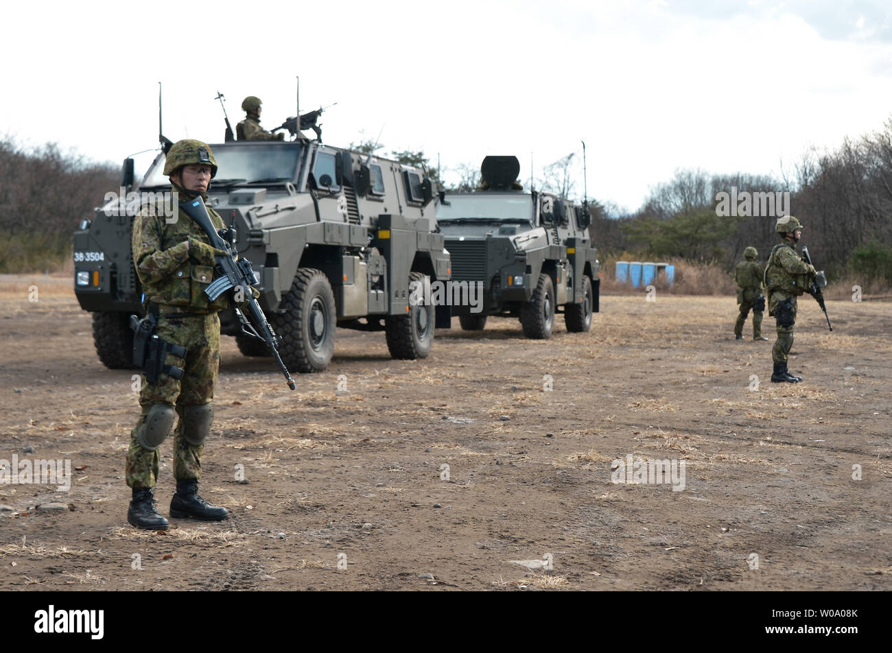 Member of JGSDF Central Readiness Regiment stand guard during an ...
