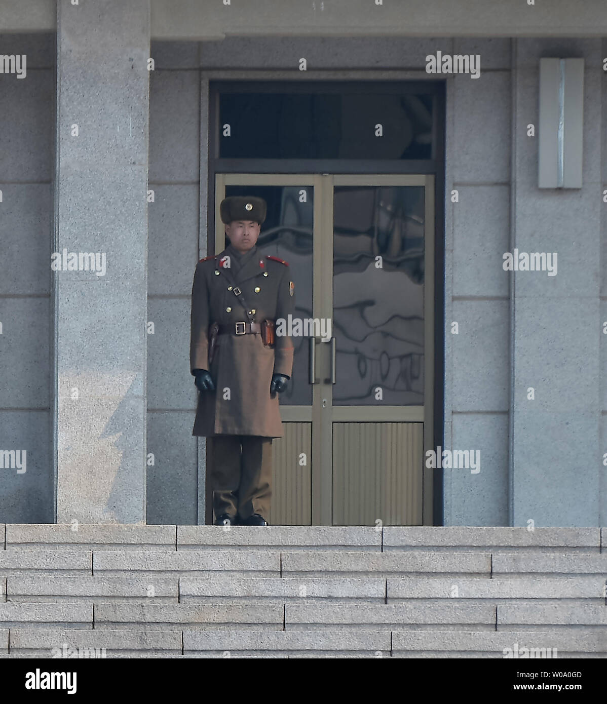 A North Korean soldier stands watching the South side at the joint ...