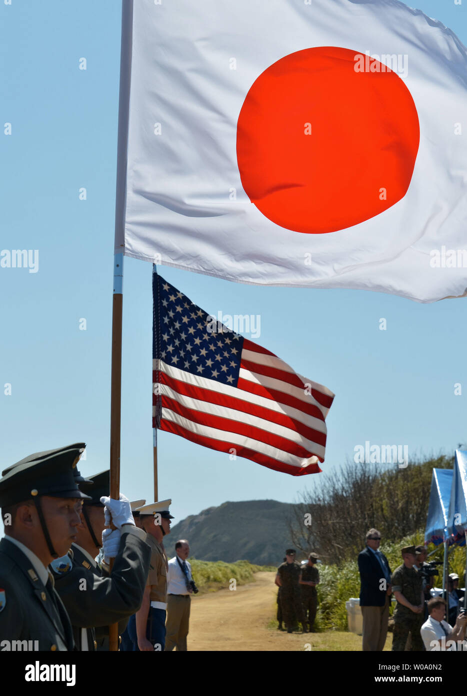 U.S. and Japanese color guards hold the national flags during the ...