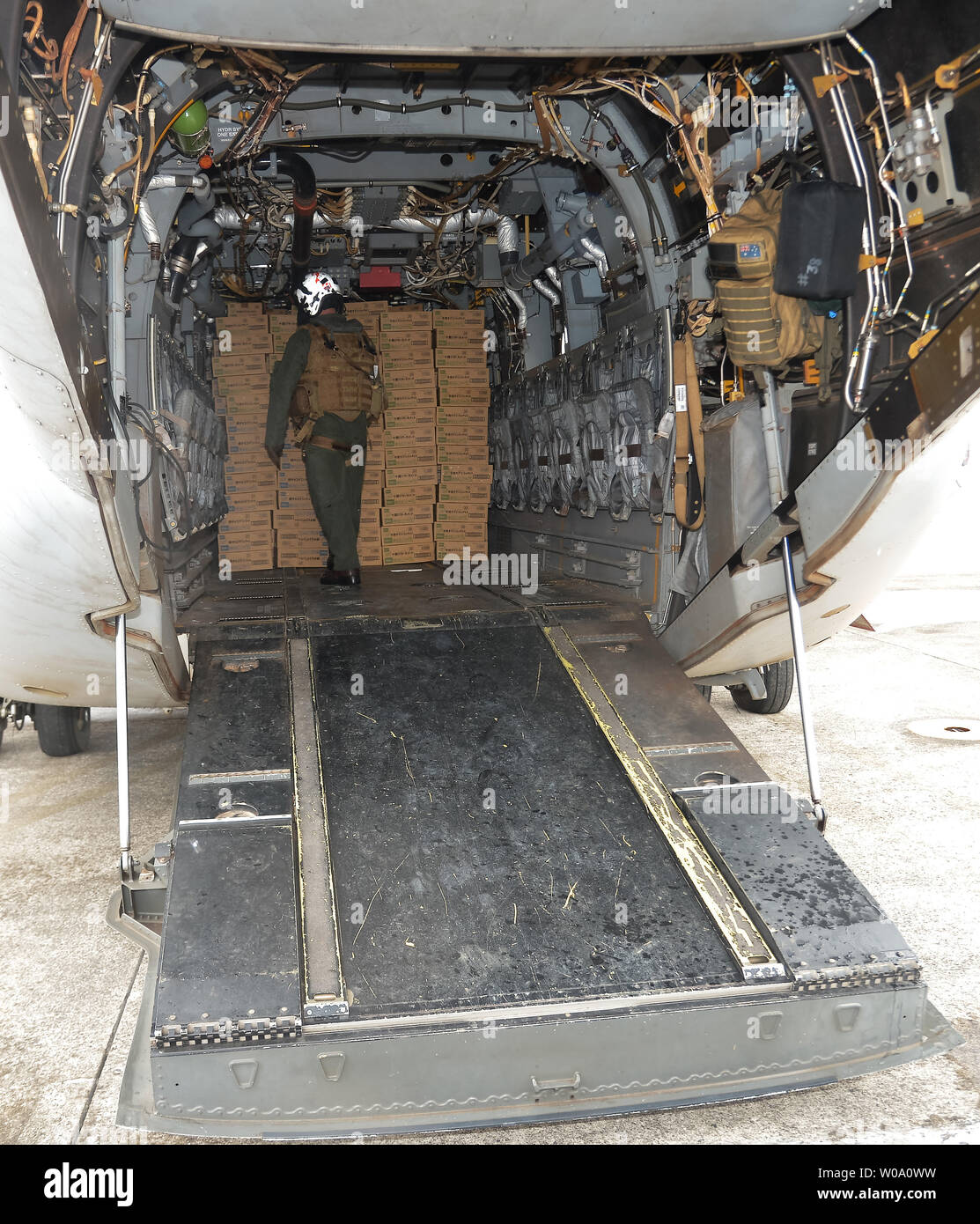 Member of U.S. Marines fixed an aid supplies on the MV-22 Osprey at the ...