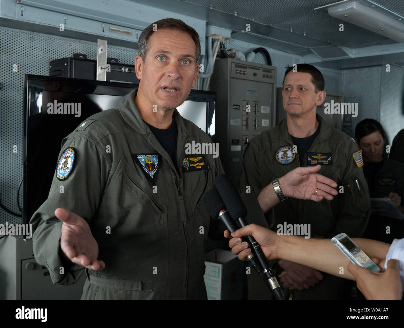 Rear Admiral Marcus A. Hitchcock(L), Commander, Carrier Strike Group 3 ...
