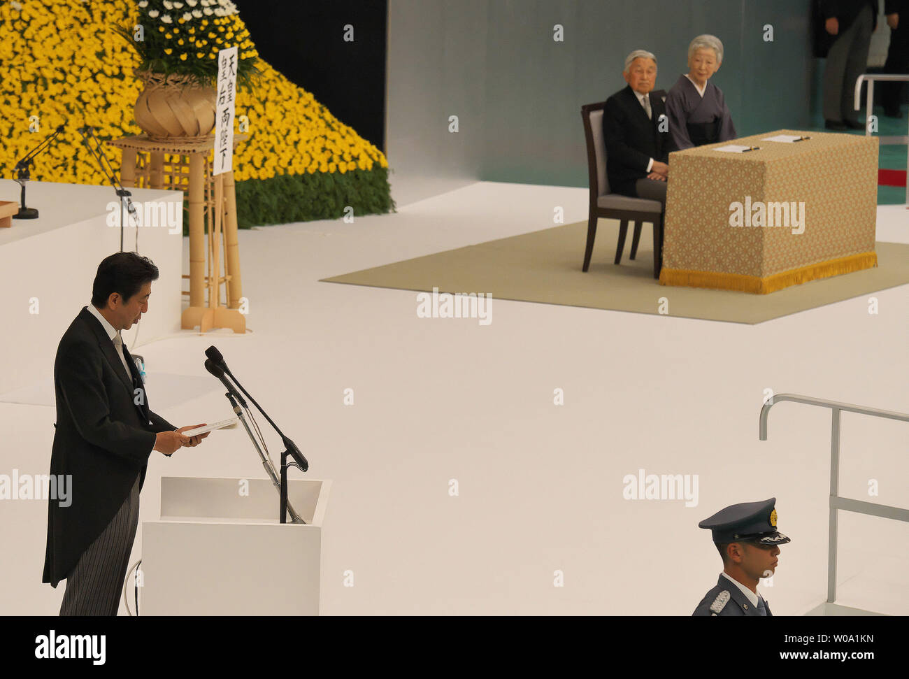 Japan's Prime Minister Shinzo Abe(L) attends the memorial service for ...