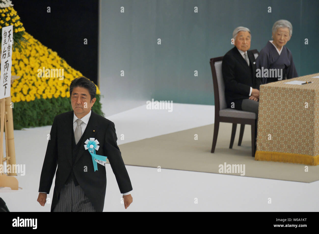 Japan's Prime Minister Shinzo Abe(L) attends the memorial service for ...