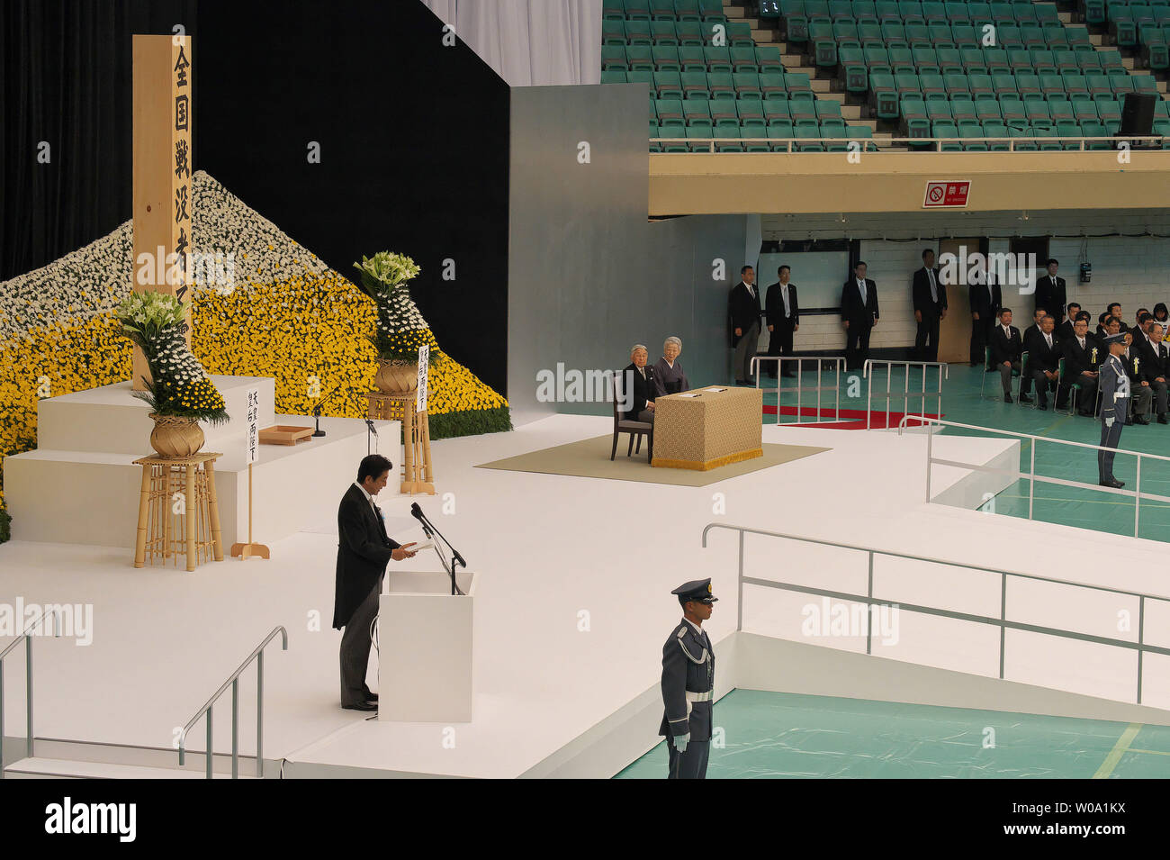 Japan's Prime Minister Shinzo Abe(L) attends the memorial service for ...