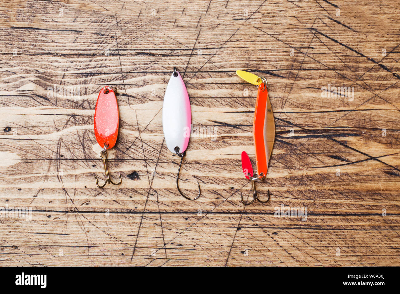 Fishing hooks and baits in a set for catching different fish on a ...