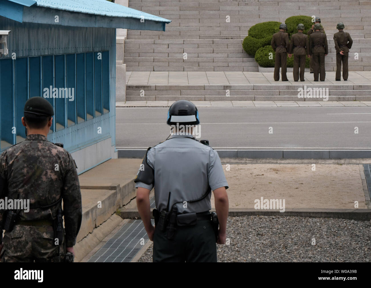 South Korean soldiers stand watching the North side at the joint ...