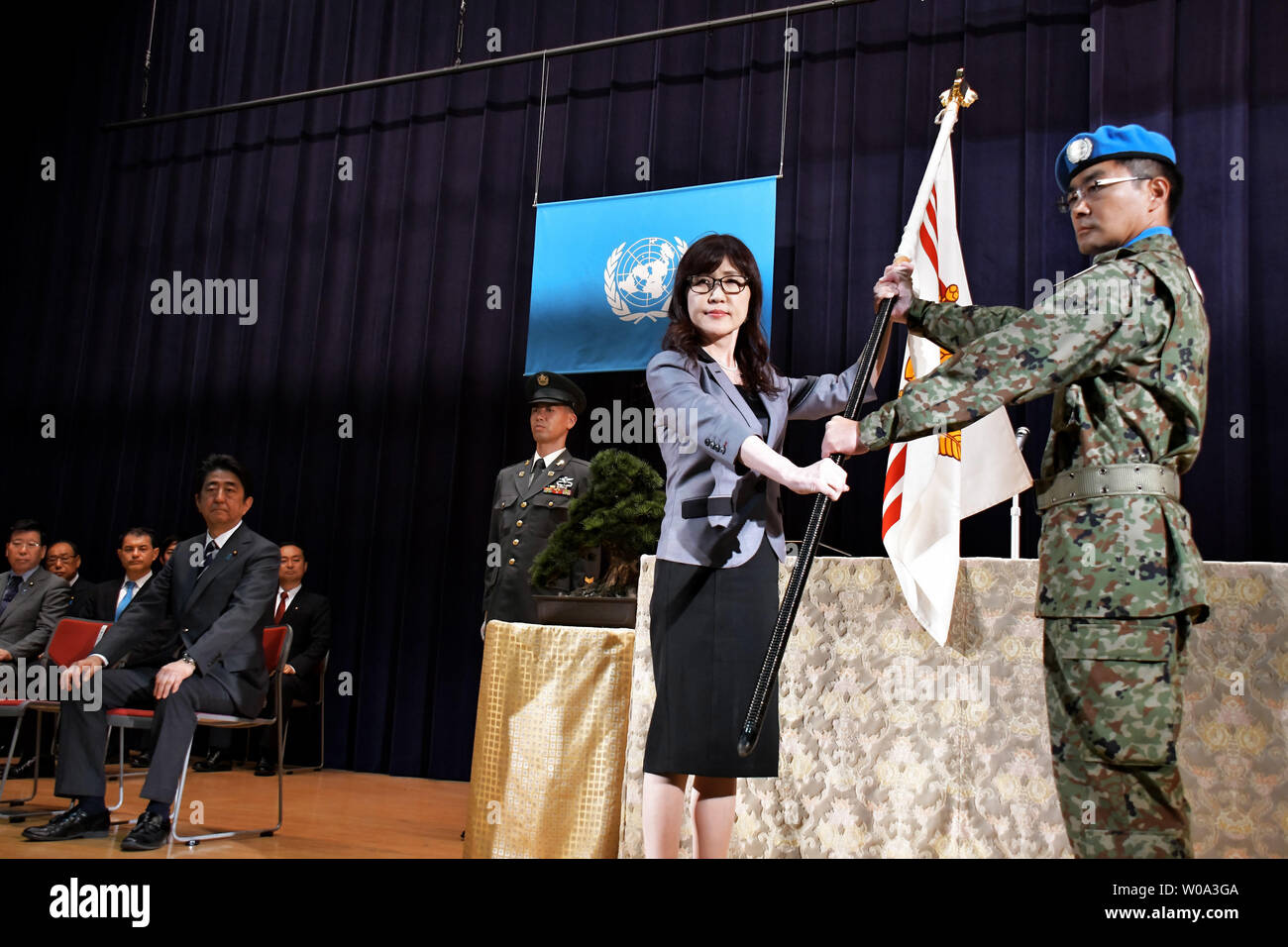 Japan's Defense Minister Tomomi Inada(C) receives the unit flag during ...