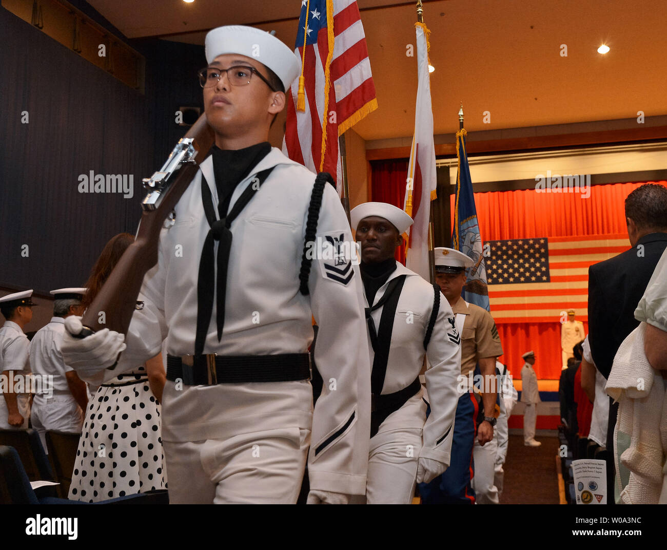 Color guards walk during a U.S. Naval Forces Japan change of command ...