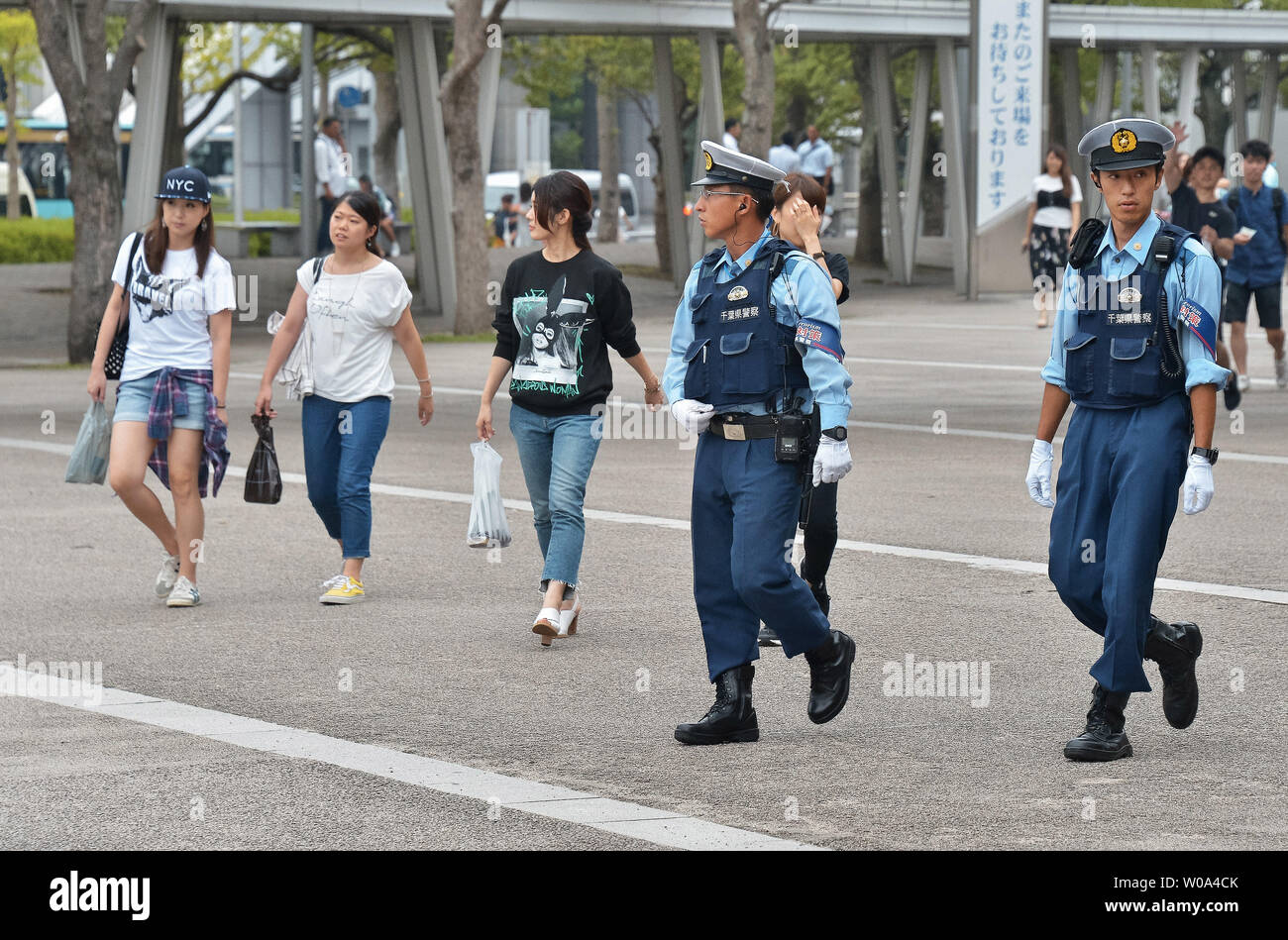 Members of Chiba prefecture Police patrol around the Makuhari Messe for ...