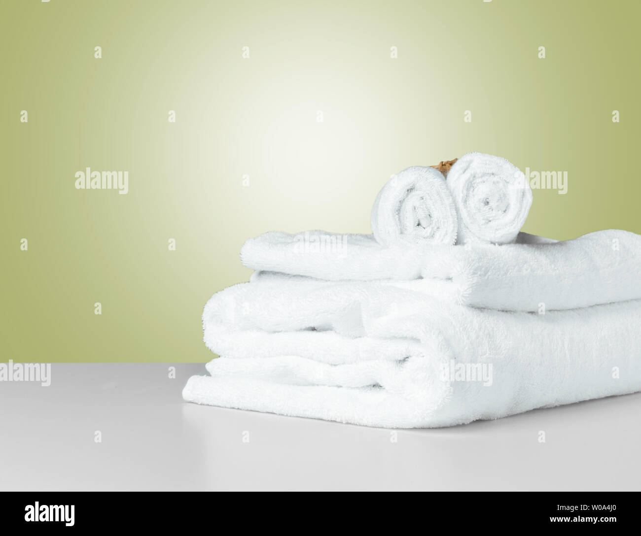 Stack of folded white spa towels Stock Photo - Alamy